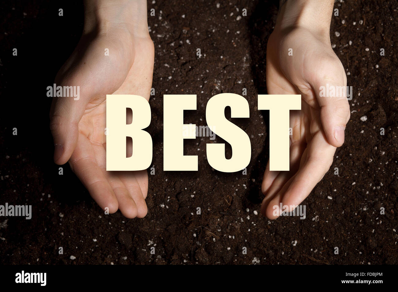 Male hands on soil background showing in palms idea word best Stock ...