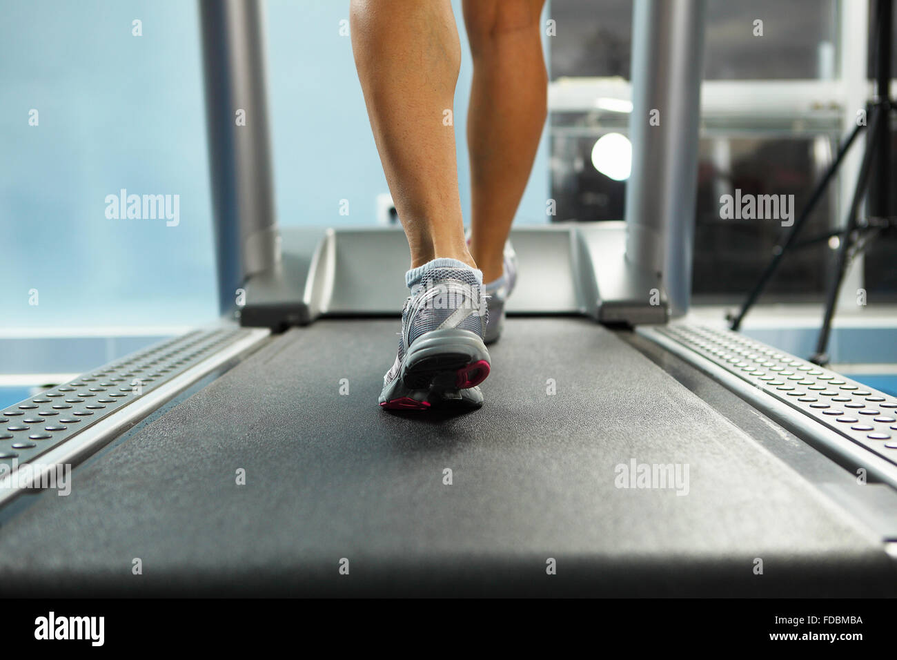 Image of female foot running on treadmill Stock Photo - Alamy