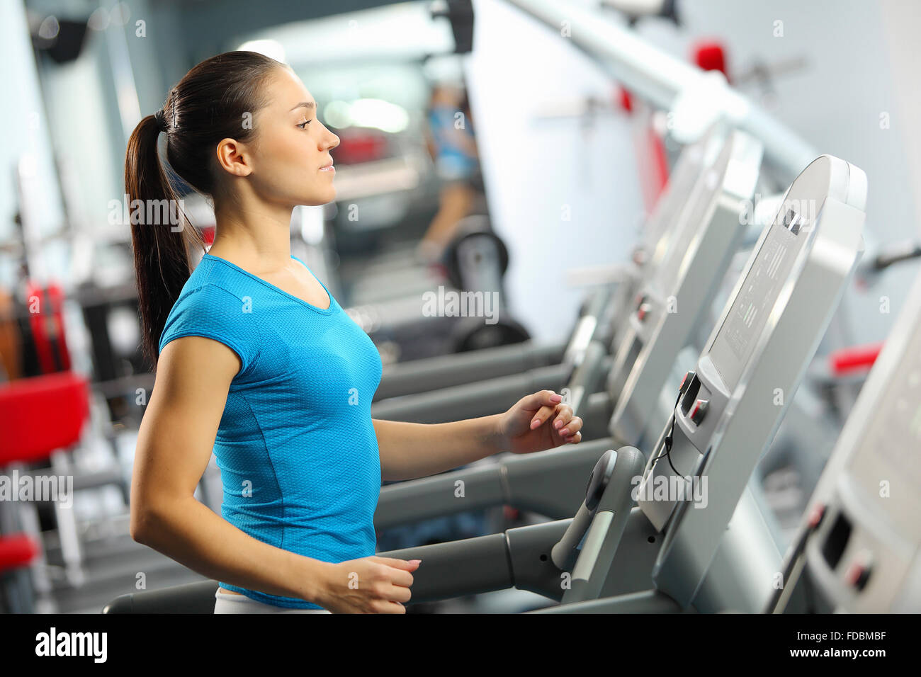 Image of fitness girl running on treadmill Stock Photo - Alamy