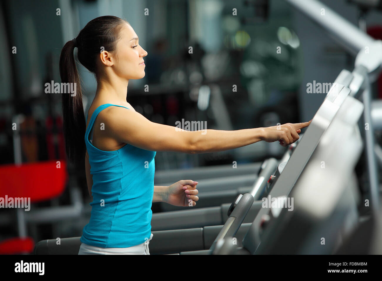 Image of fitness girl running on treadmill Stock Photo - Alamy