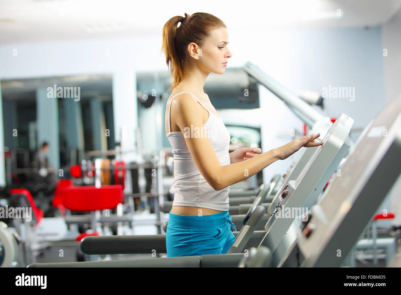Image of fitness girl running on treadmill Stock Photo - Alamy