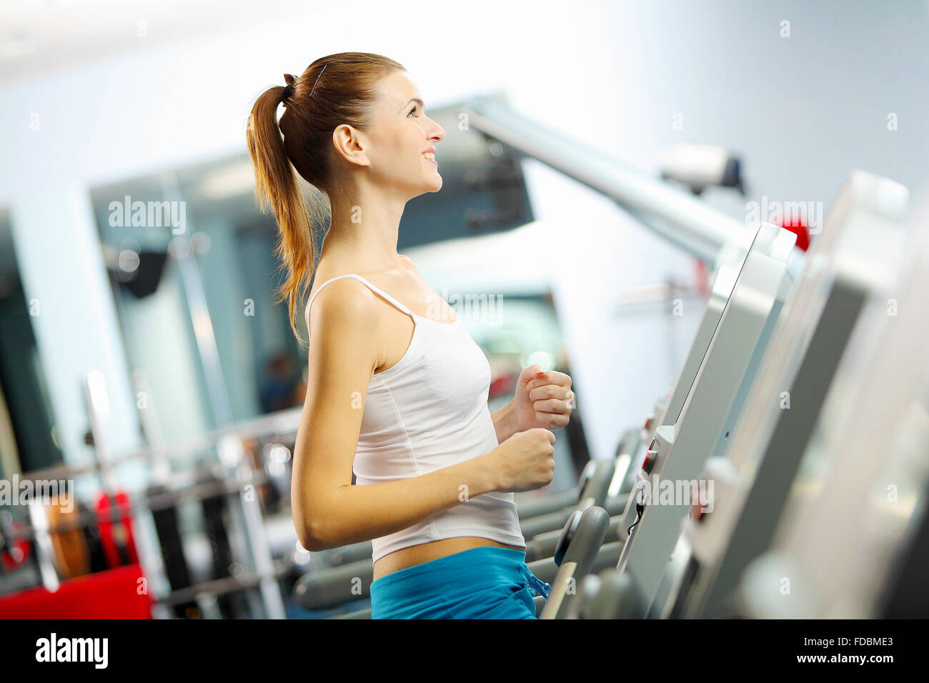 Image of fitness girl running on treadmill Stock Photo - Alamy