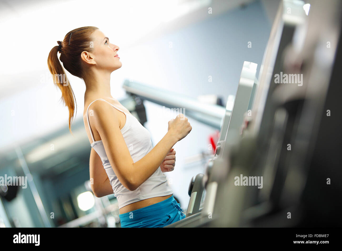 Image of fitness girl running on treadmill Stock Photo - Alamy