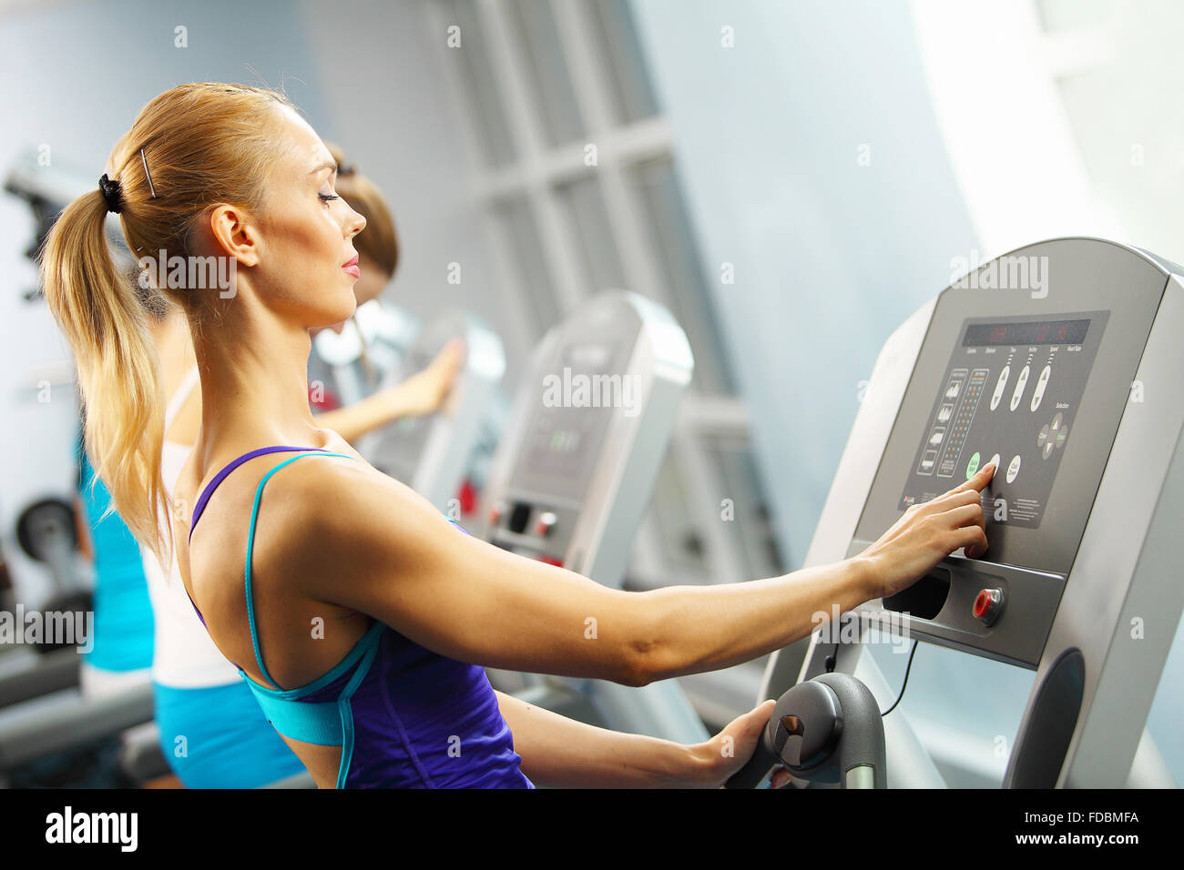 Image of fitness girl running on treadmill Stock Photo - Alamy