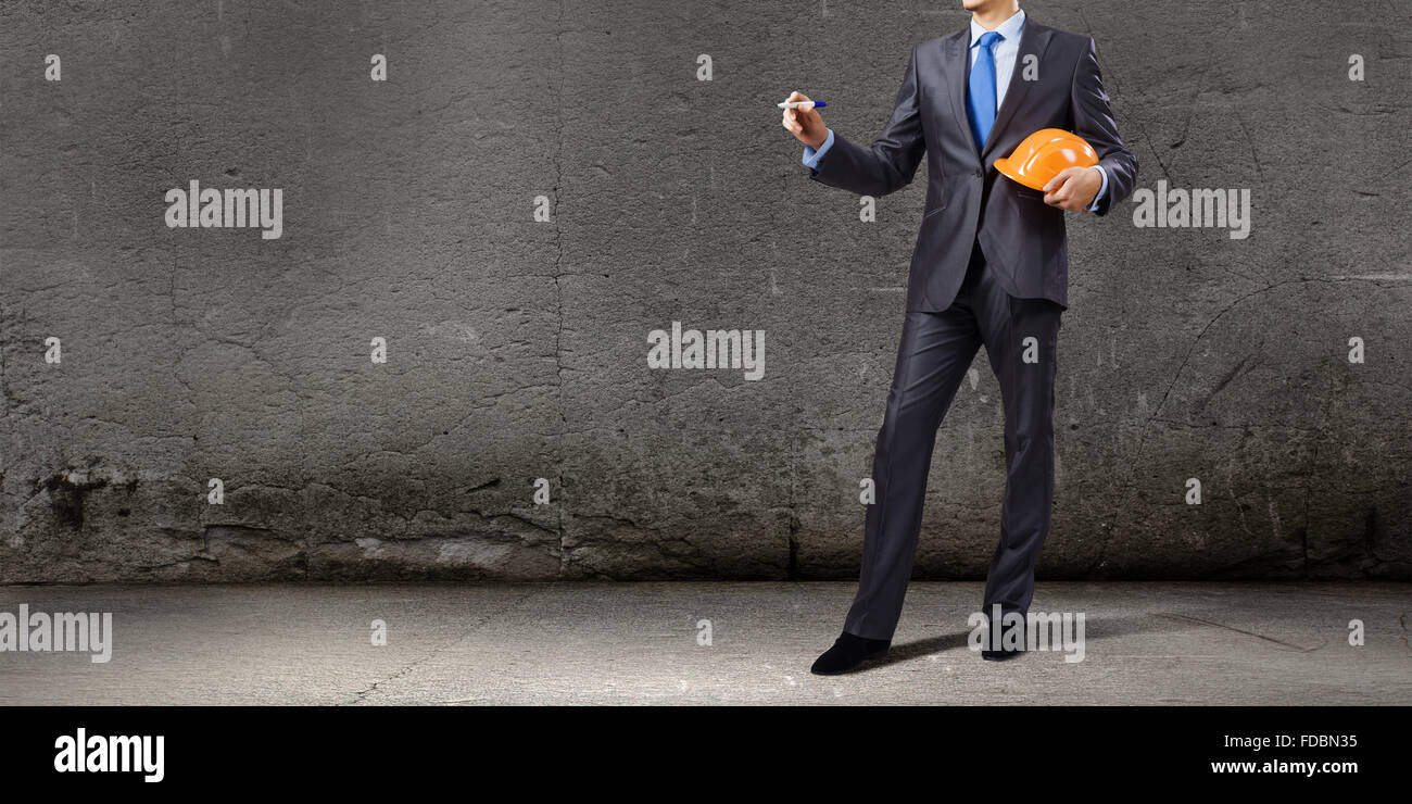 Young man engineer drawing sketches of construction project Stock Photo ...