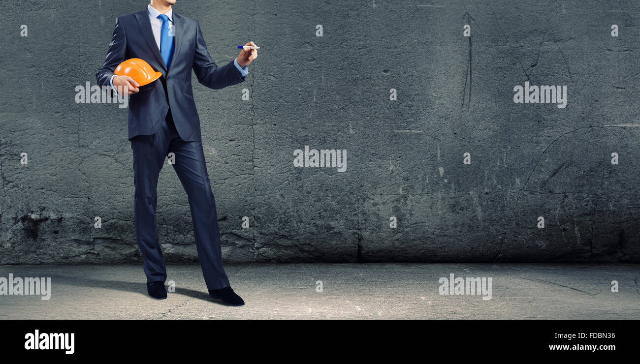 Young man engineer drawing sketches of construction project Stock Photo ...