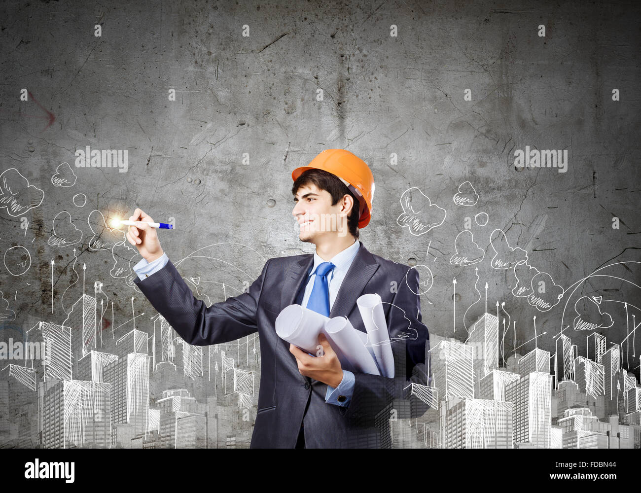 Young man engineer drawing sketches of construction project Stock Photo ...