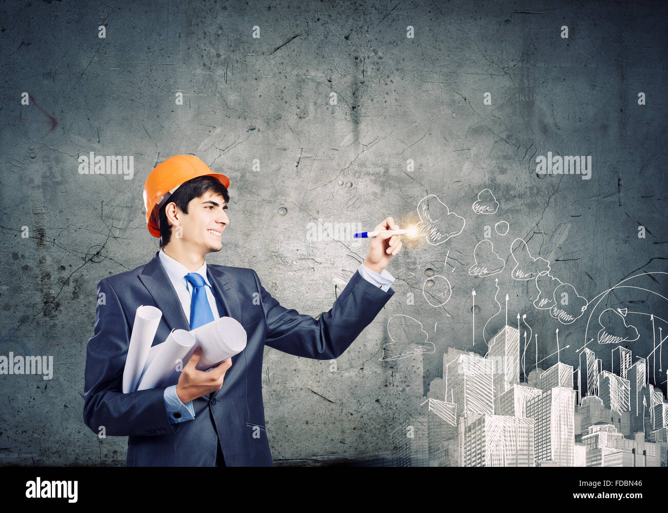 Young man engineer drawing sketches of construction project Stock Photo ...