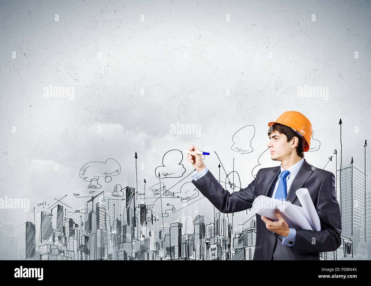 Young man engineer drawing sketches of construction project Stock Photo ...