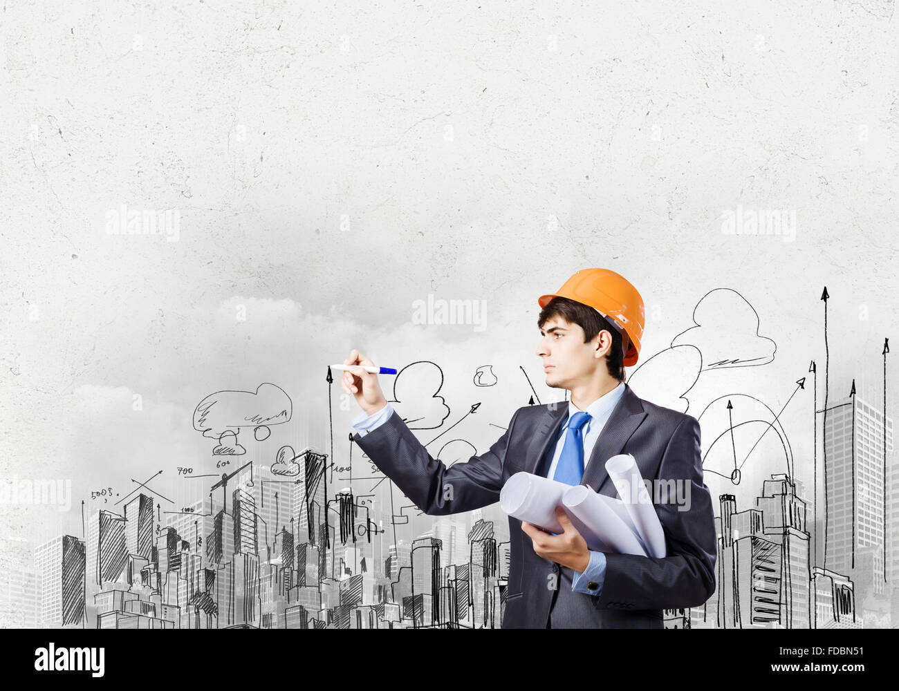 Young man engineer drawing sketches of construction project Stock Photo ...