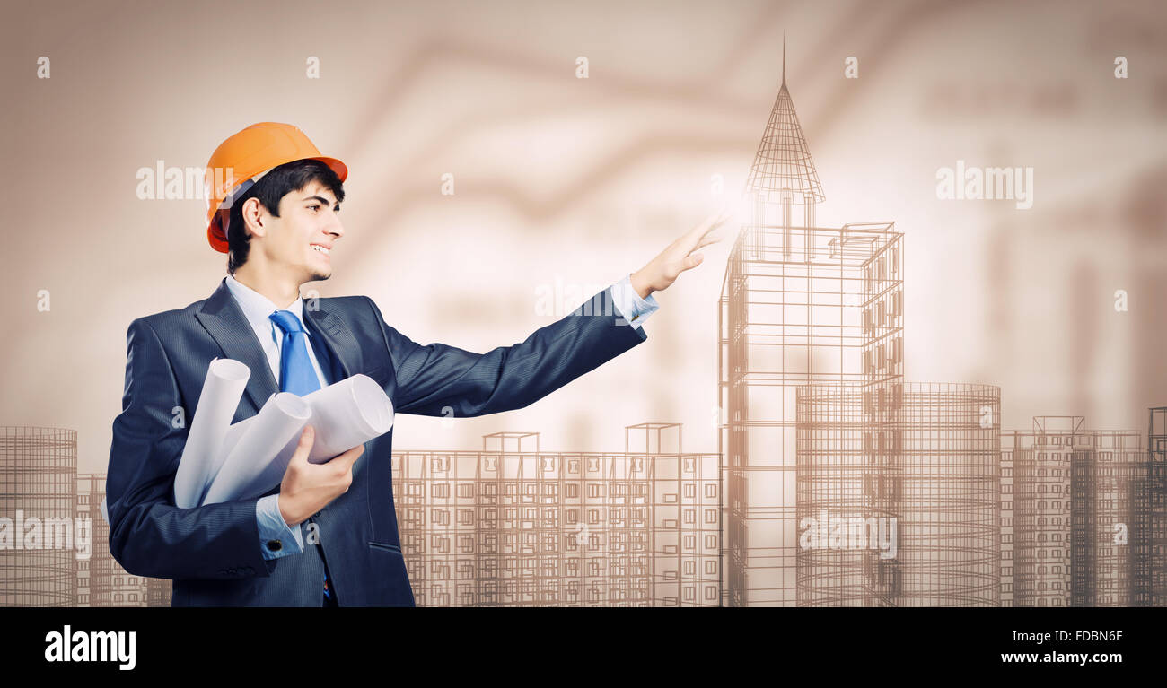 Young man engineer touching icon of media screen Stock Photo - Alamy