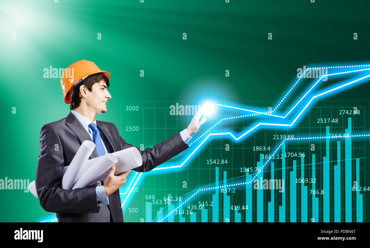 Young man engineer touching icon of media screen Stock Photo - Alamy