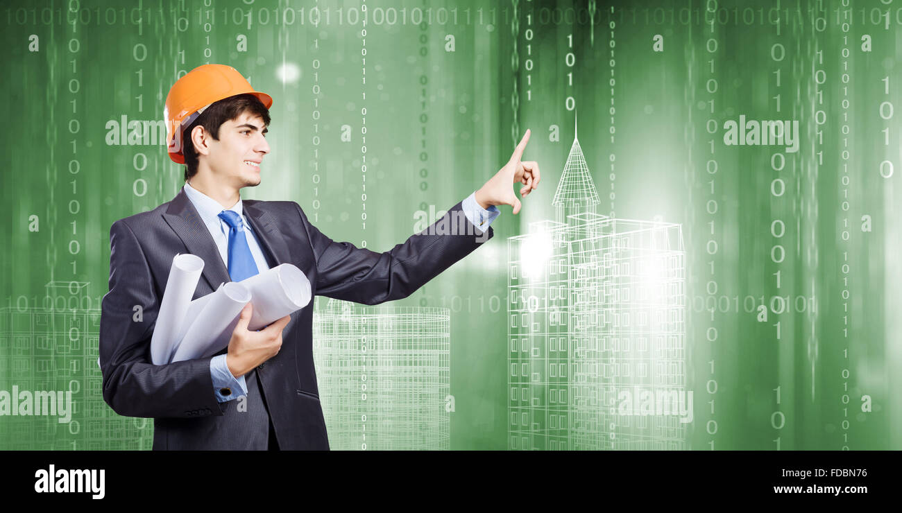 Young man engineer touching icon of media screen Stock Photo - Alamy