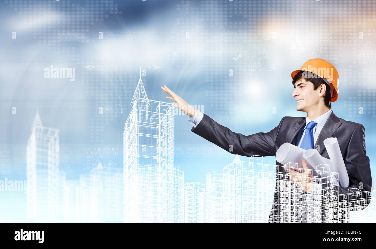 Young man engineer touching icon of media screen Stock Photo - Alamy