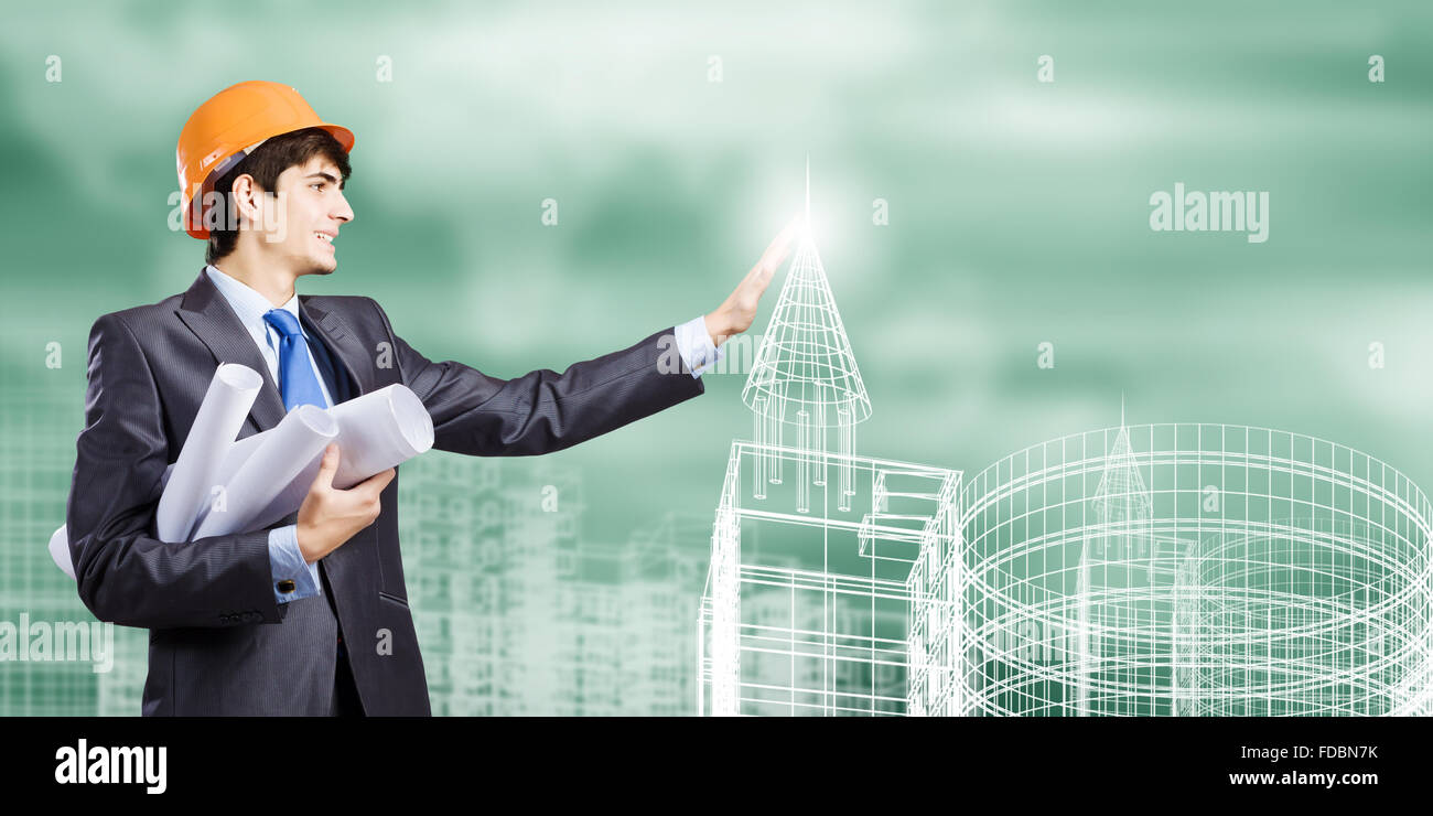 Young man engineer touching icon of media screen Stock Photo - Alamy