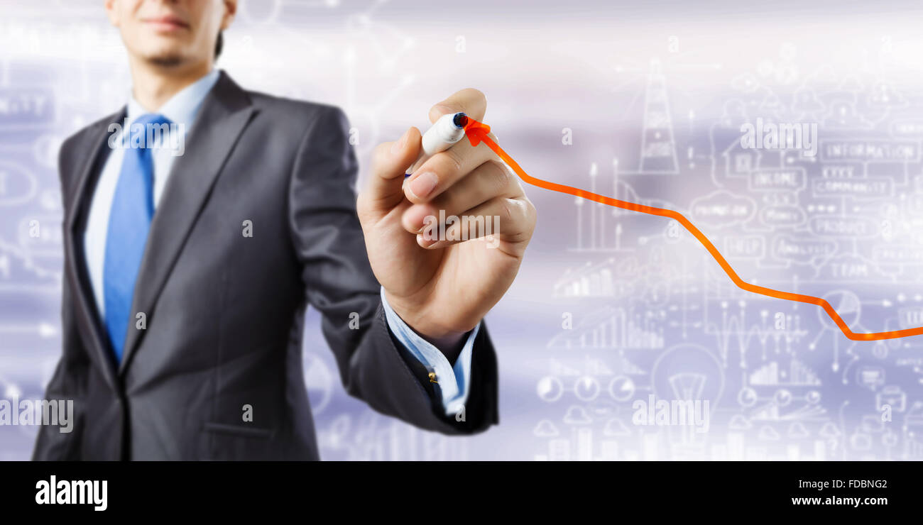 Close up of businessman drawing increasing graph with marker Stock ...