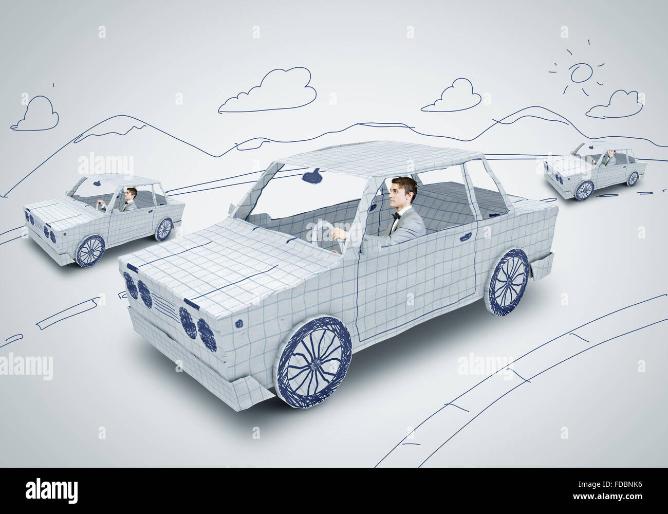 Young man driving car made of sheet of paper Stock Photo - Alamy