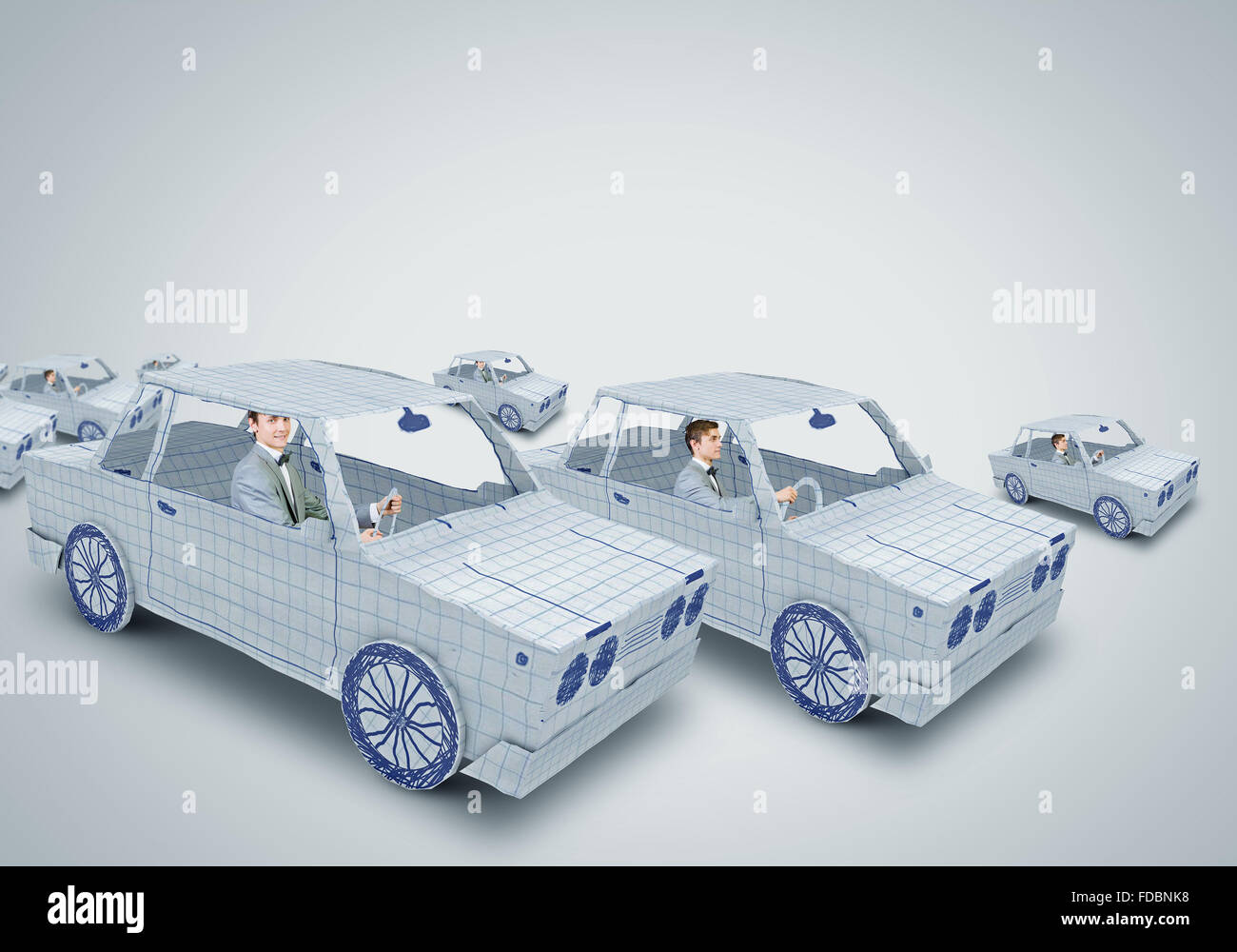 Young man driving car made of sheet of paper Stock Photo - Alamy