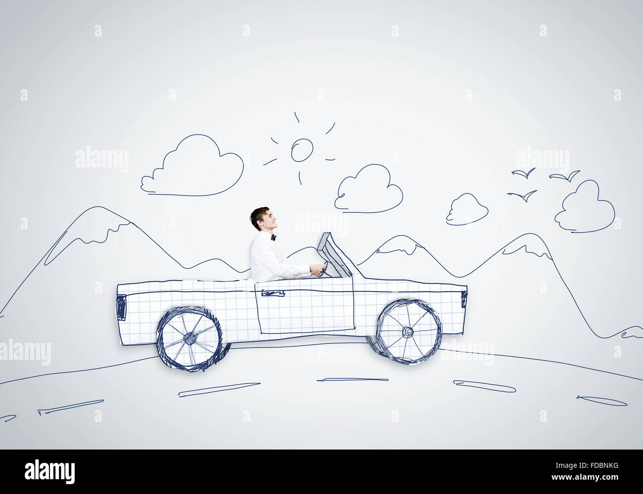 Young man driving car made of sheet of paper Stock Photo - Alamy