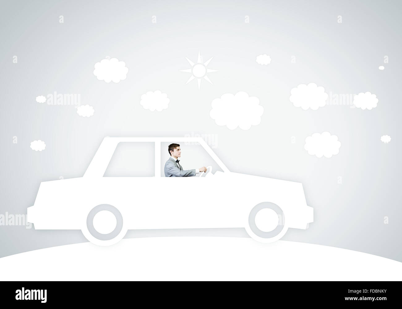Young man driving car made of sheet of paper Stock Photo - Alamy