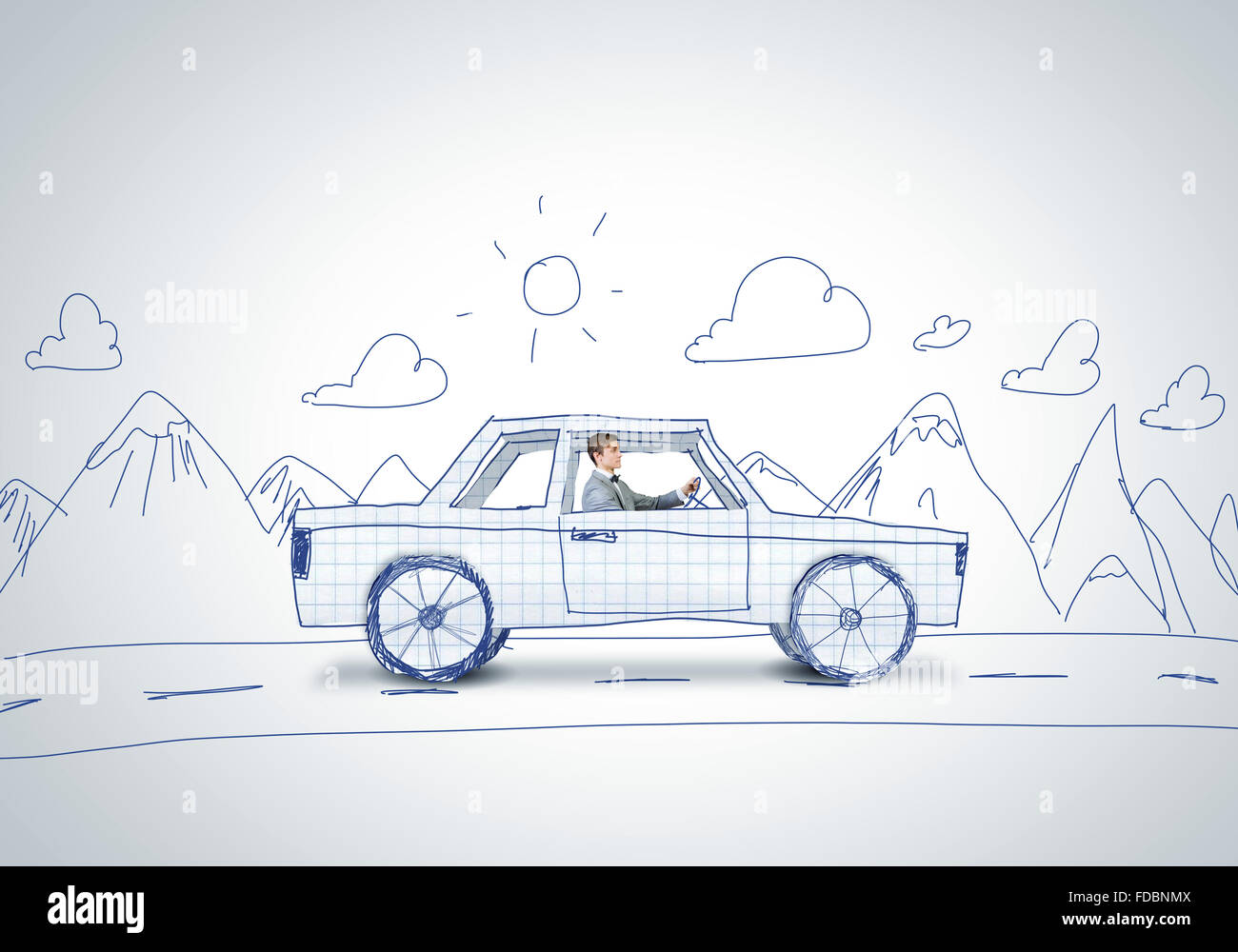 Young man driving car made of sheet of paper Stock Photo - Alamy