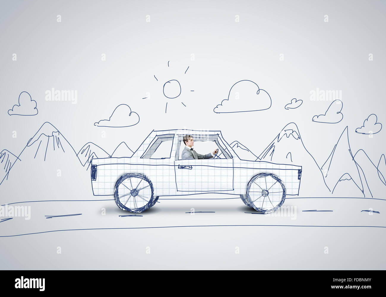 Young man driving car made of sheet of paper Stock Photo - Alamy