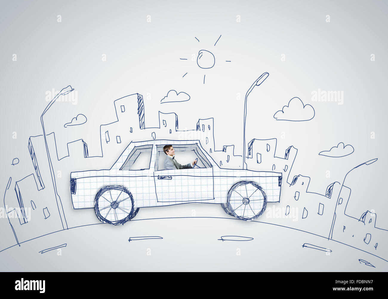 Young man driving car made of sheet of paper Stock Photo - Alamy