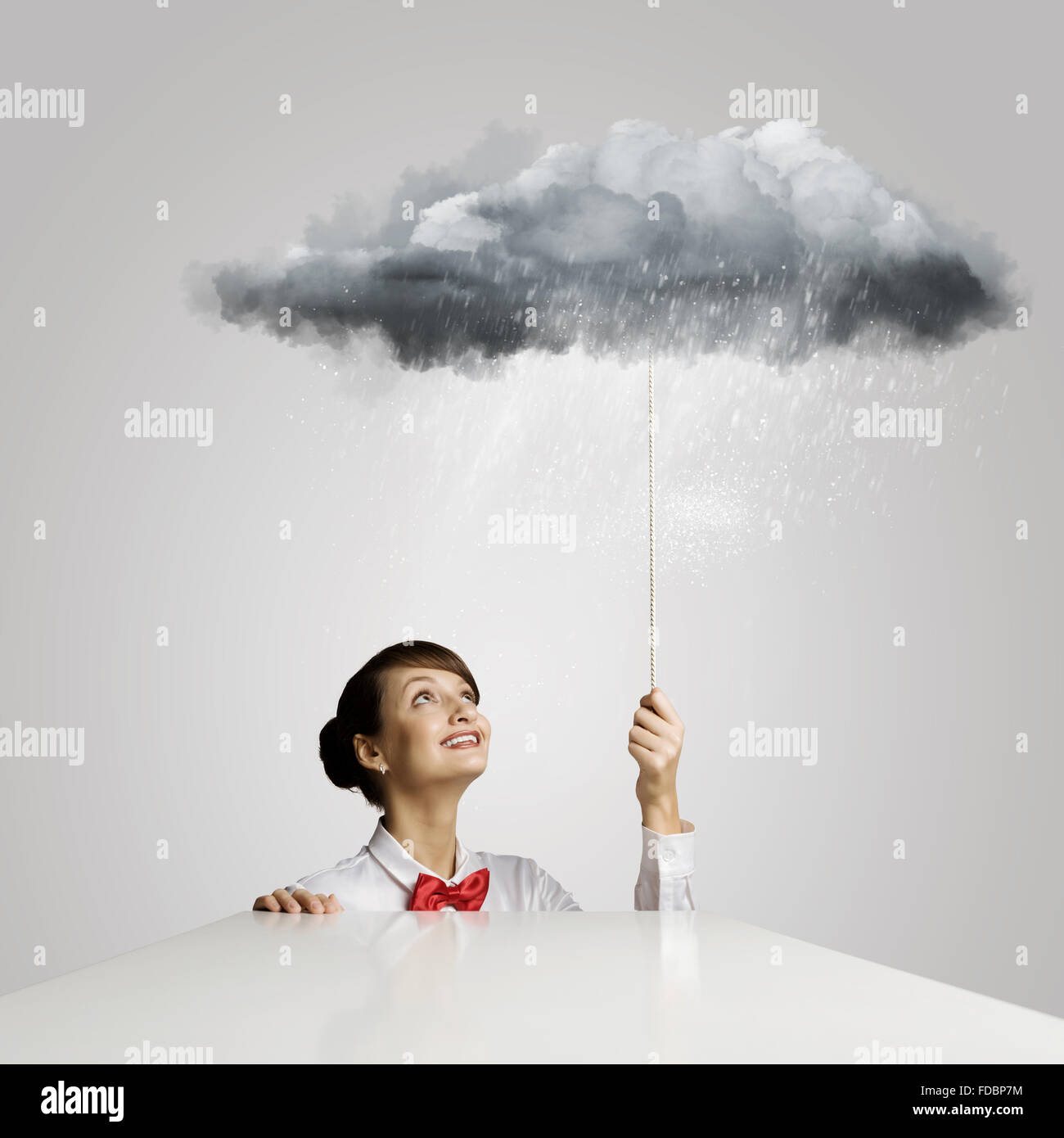 Young woman looking above at raining cloud Stock Photo - Alamy