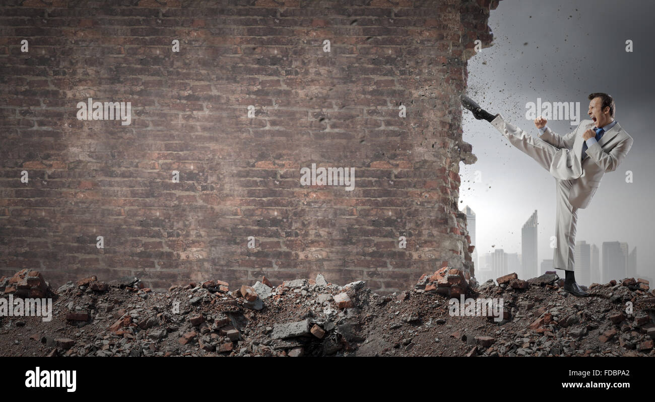 Businessman breaking stone wall karate hi-res stock photography and ...