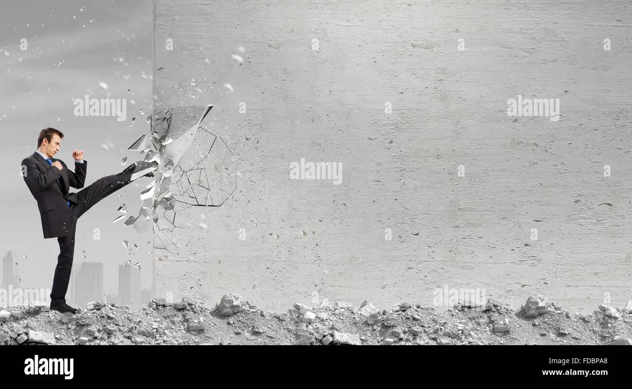 Businessman breaking stone wall karate hi-res stock photography and ...