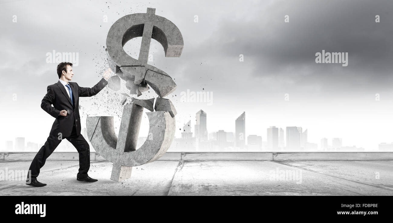 Businessman breaking stone dollar symbol with karate punch Stock Photo ...