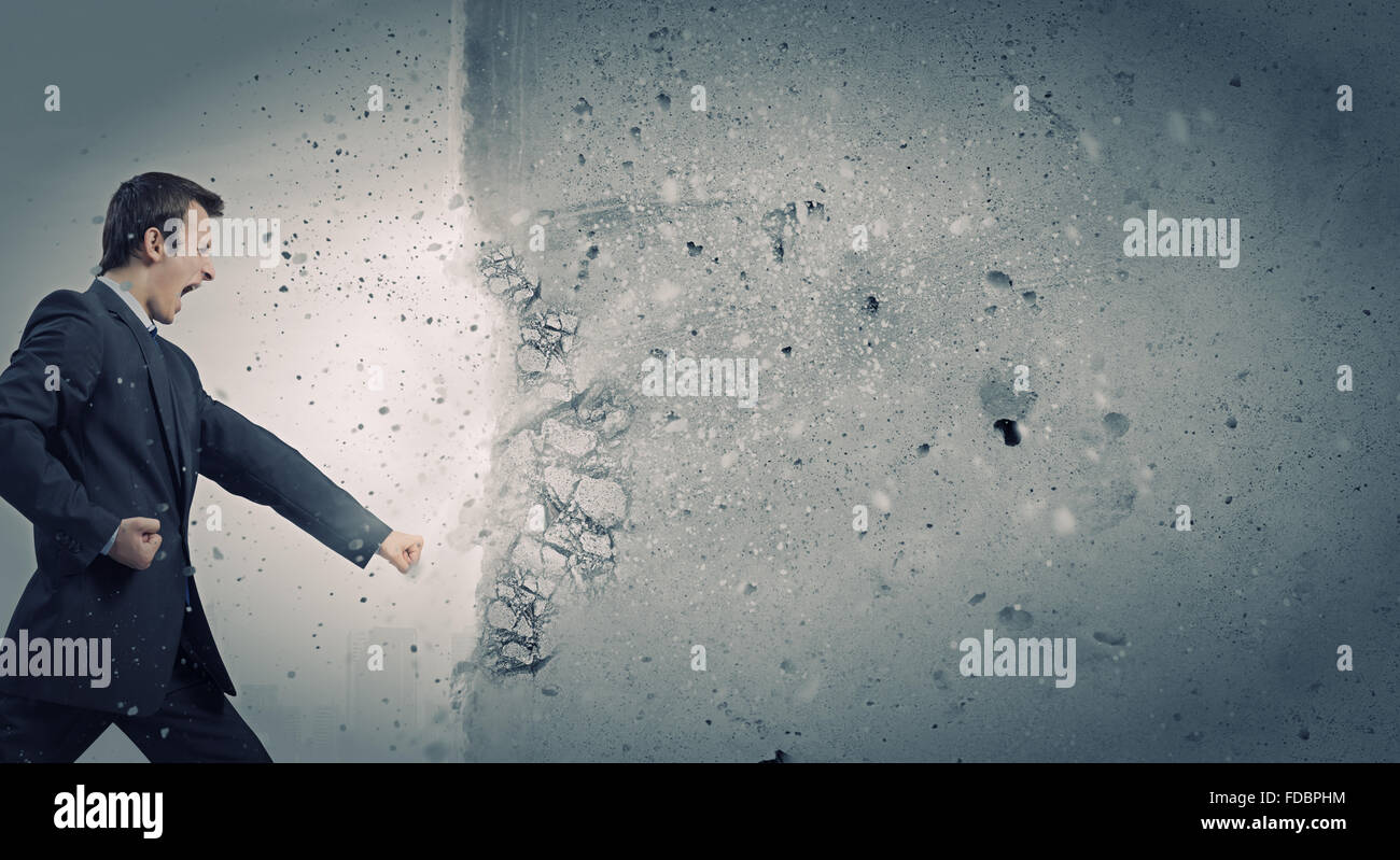 Businessman breaking stone wall karate hi-res stock photography and ...