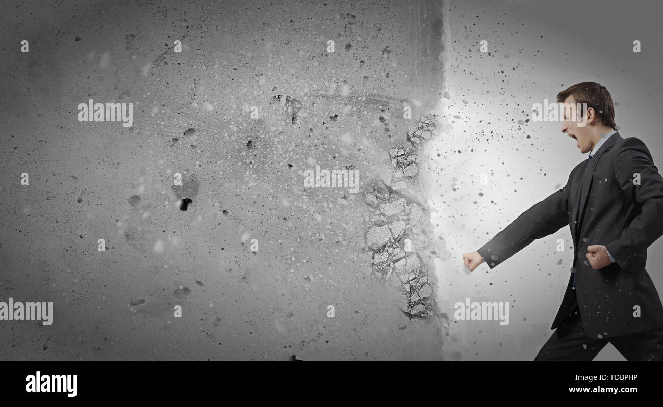 Businessman breaking stone wall karate hi-res stock photography and ...