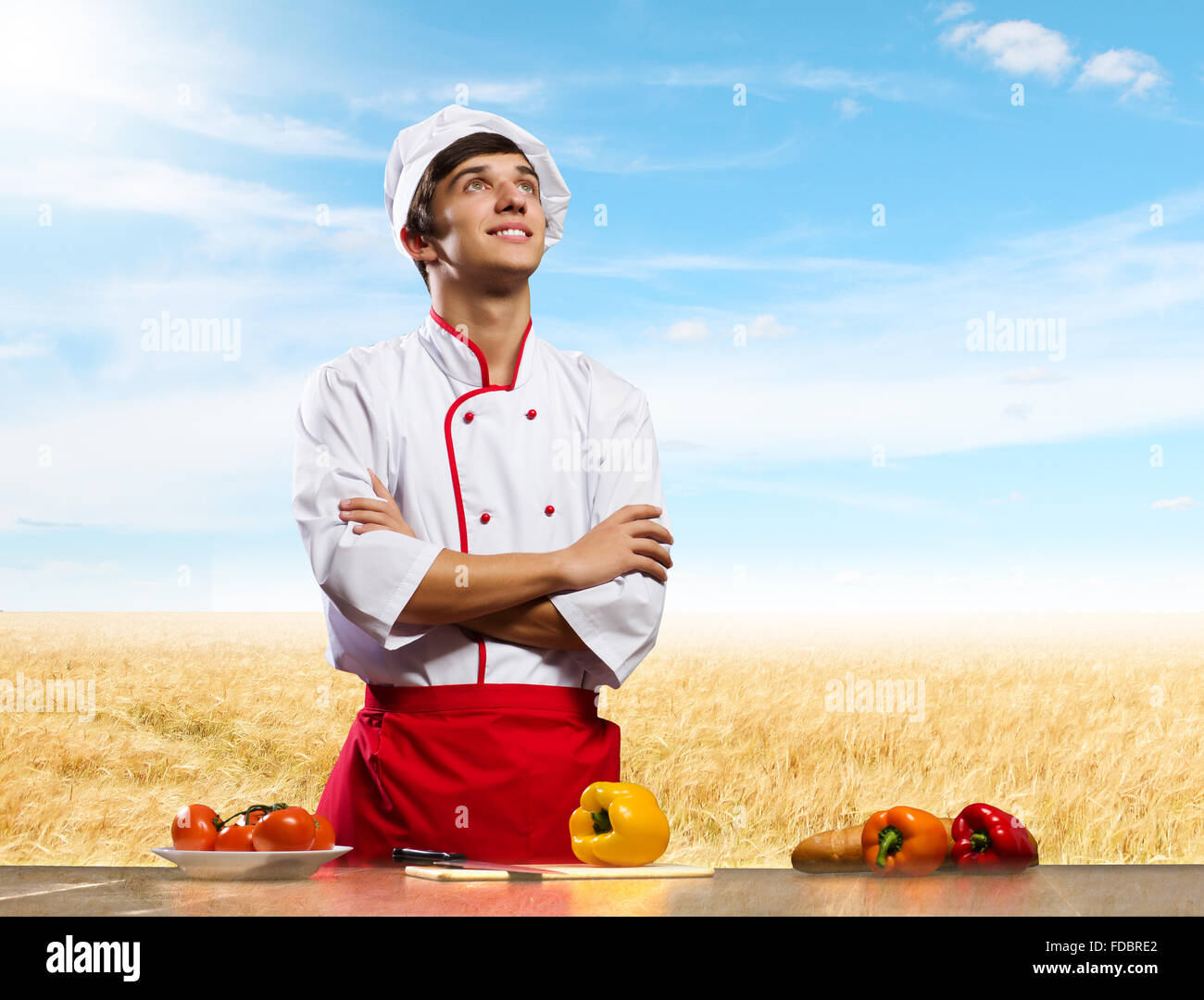 Young cheerful cook and ingredients flying in air Stock Photo - Alamy