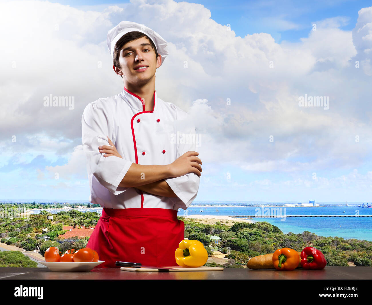 Young cheerful cook and ingredients flying in air Stock Photo - Alamy