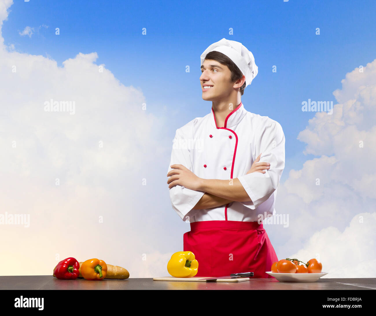 Young cheerful cook and ingredients flying in air Stock Photo - Alamy