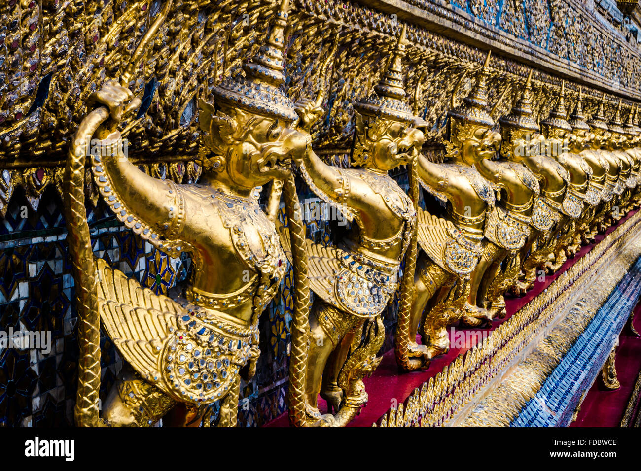 Golden garuda pattern standing at wat pha kaew Stock Photo - Alamy