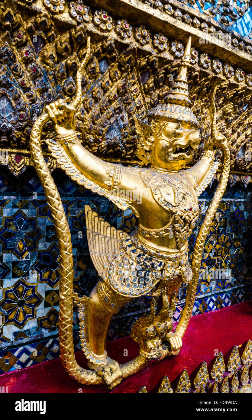 Golden garuda pattern standing at wat pha kaew Stock Photo - Alamy