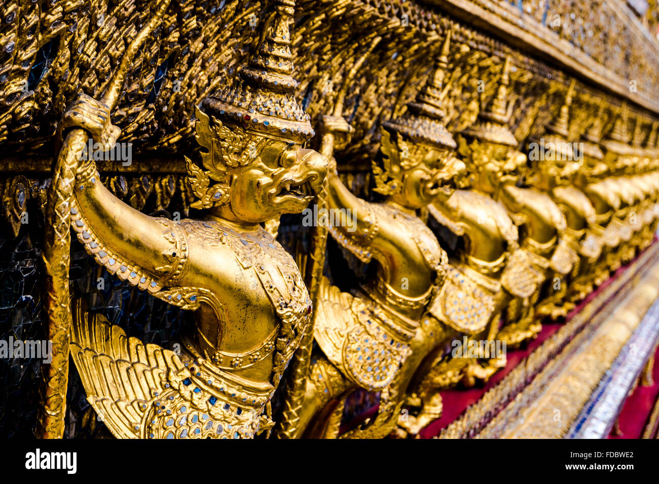 Golden garuda pattern standing at wat pha kaew Stock Photo - Alamy