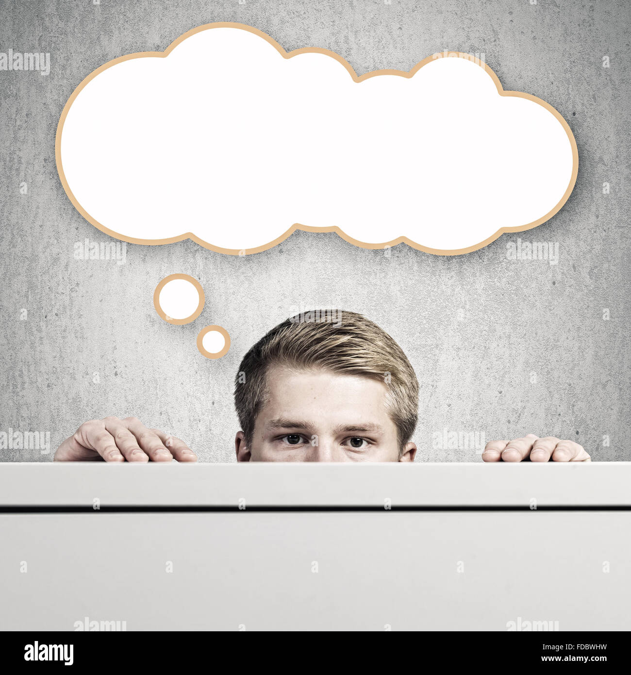 Half face of young man looking out from under table hi-res stock ...
