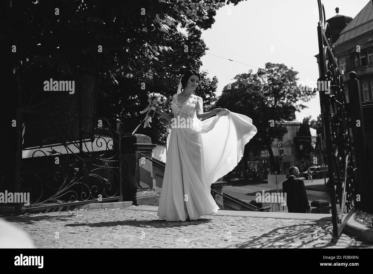 Bride posing on the background of the old town Stock Photo - Alamy