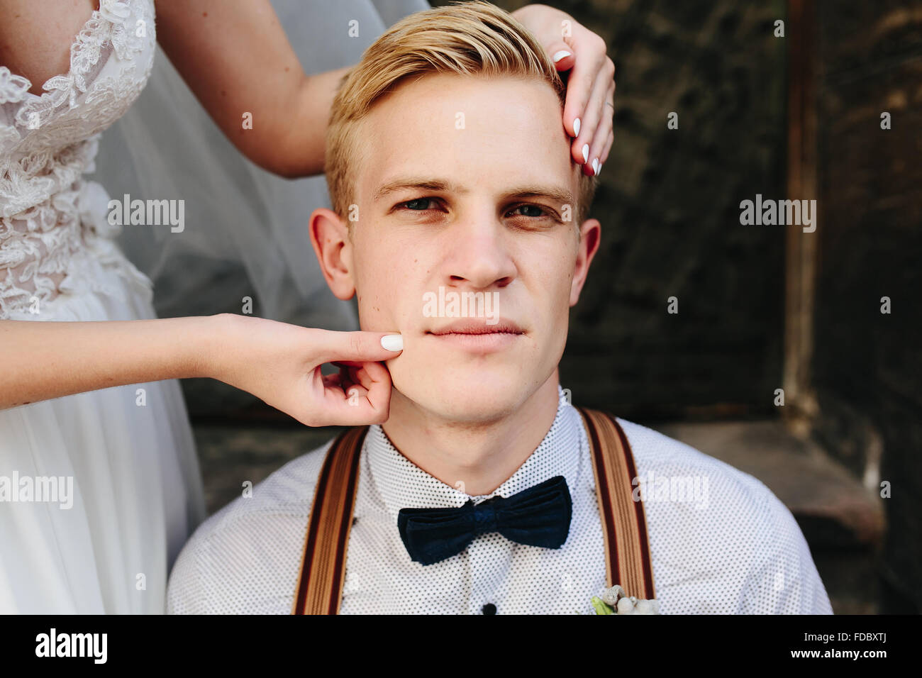 Bride leaning on the groom, and tenderly embraces him Stock Photo - Alamy
