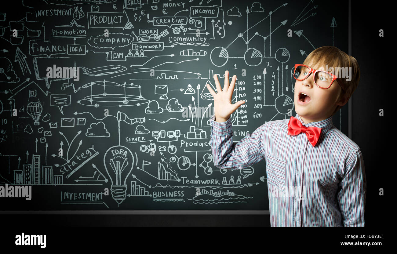 Genius boy in red glasses near blackboard with formulas Stock Photo - Alamy