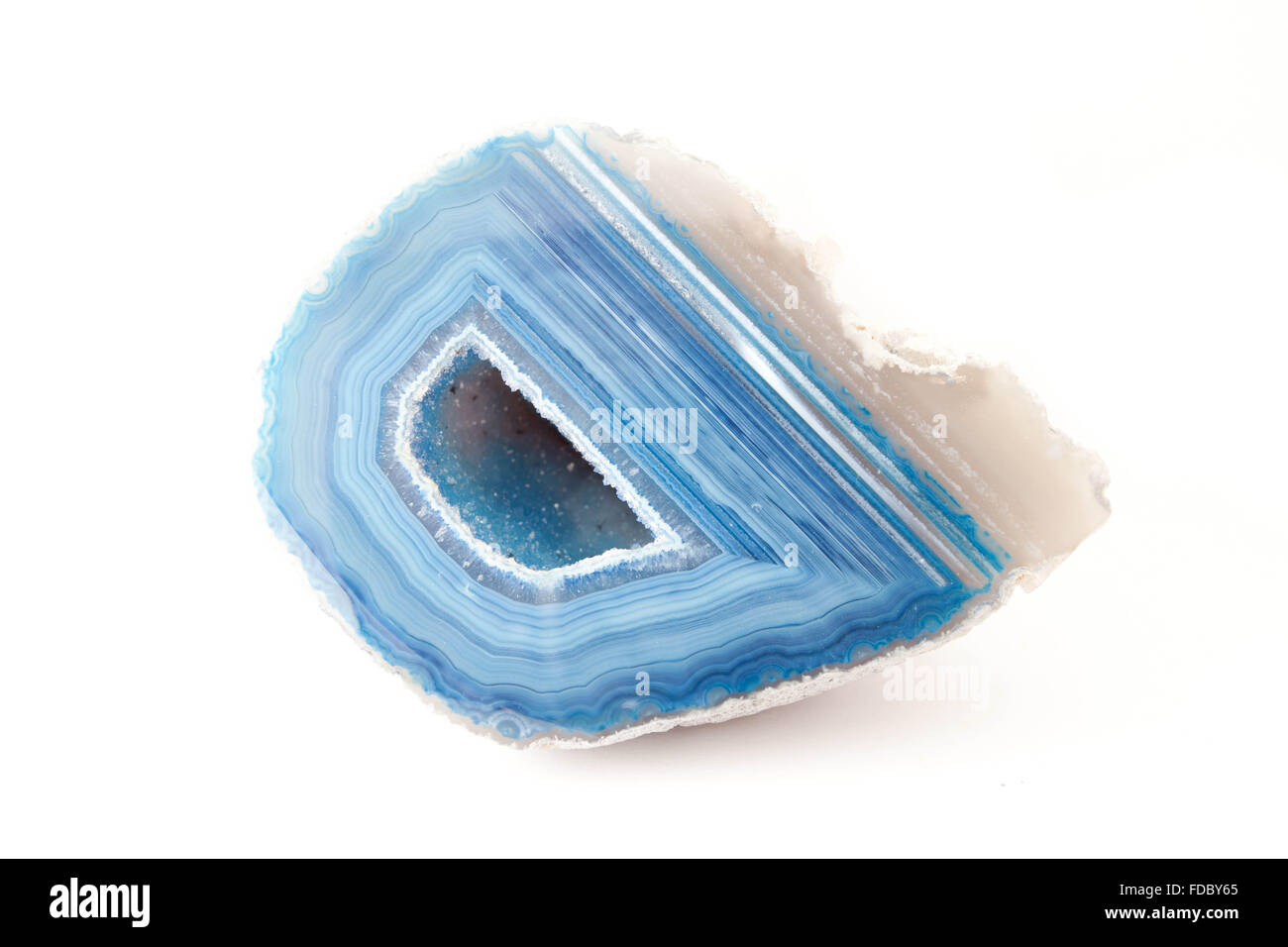 Section of a white and blue geode in white background Stock Photo - Alamy