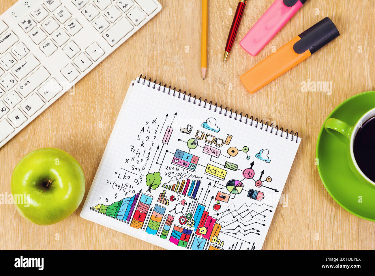 Keyboard cup of coffee and notepad at table Stock Photo - Alamy