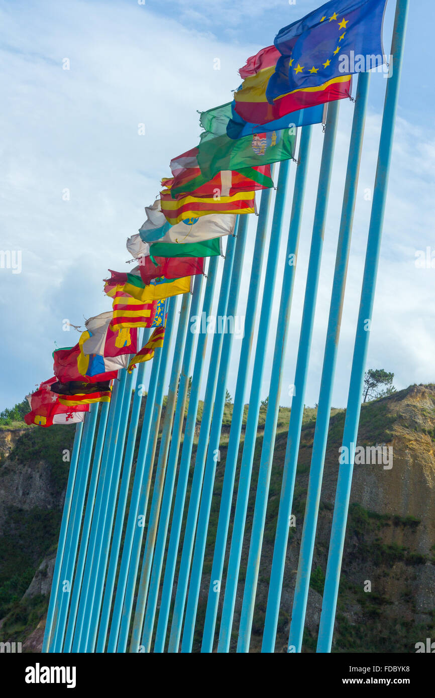 Regional flags of Spain in the wind over long blue poles Stock Photo ...