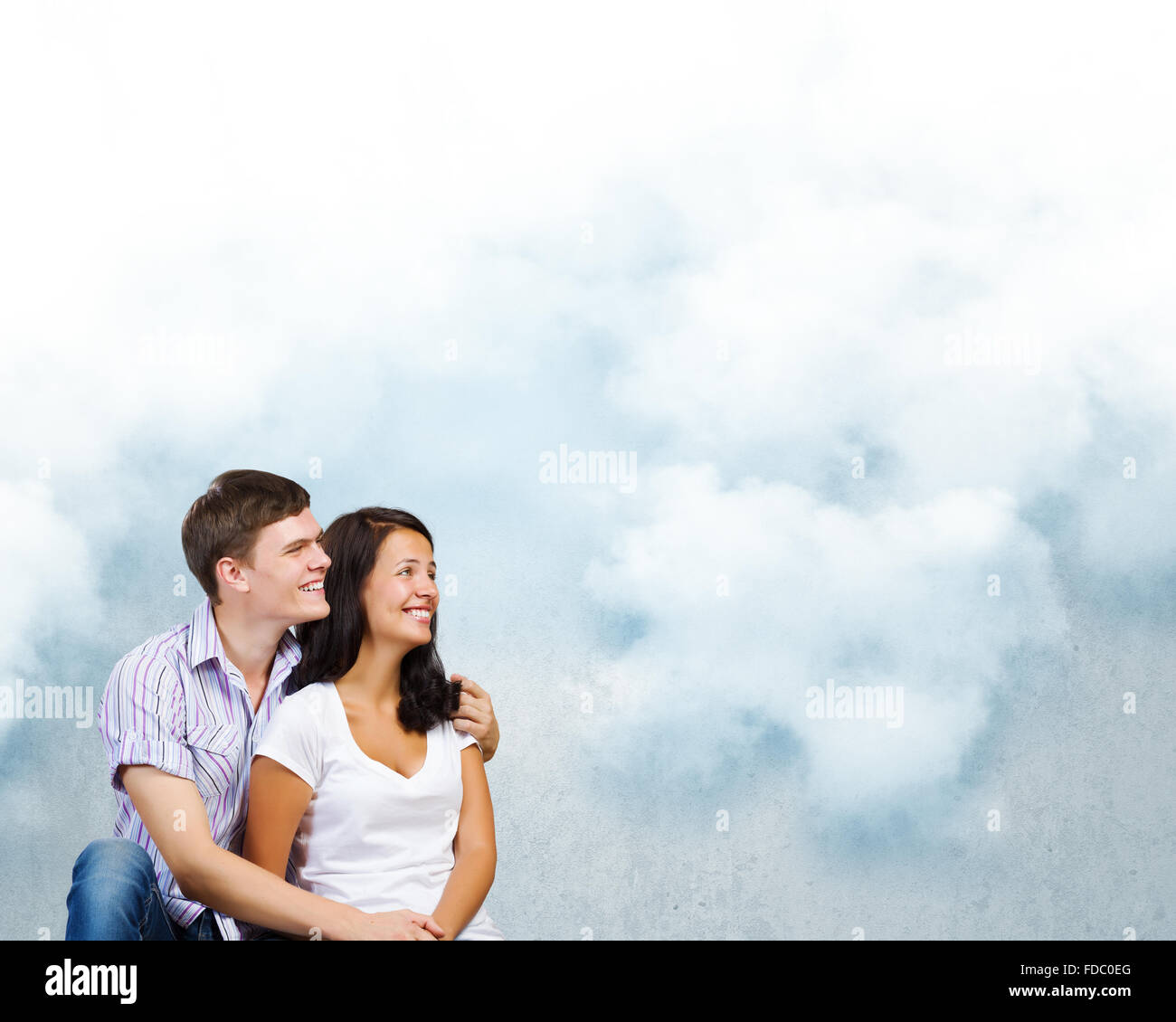 Young couple hugging each other and dreaming about future Stock Photo ...