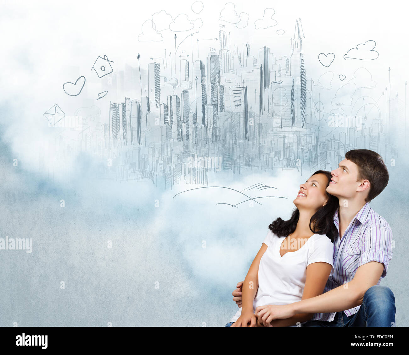 Young couple hugging each other and dreaming about future Stock Photo ...