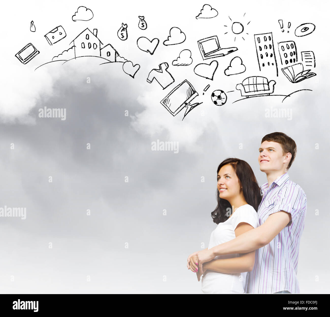 Young couple hugging each other and dreaming about future Stock Photo ...