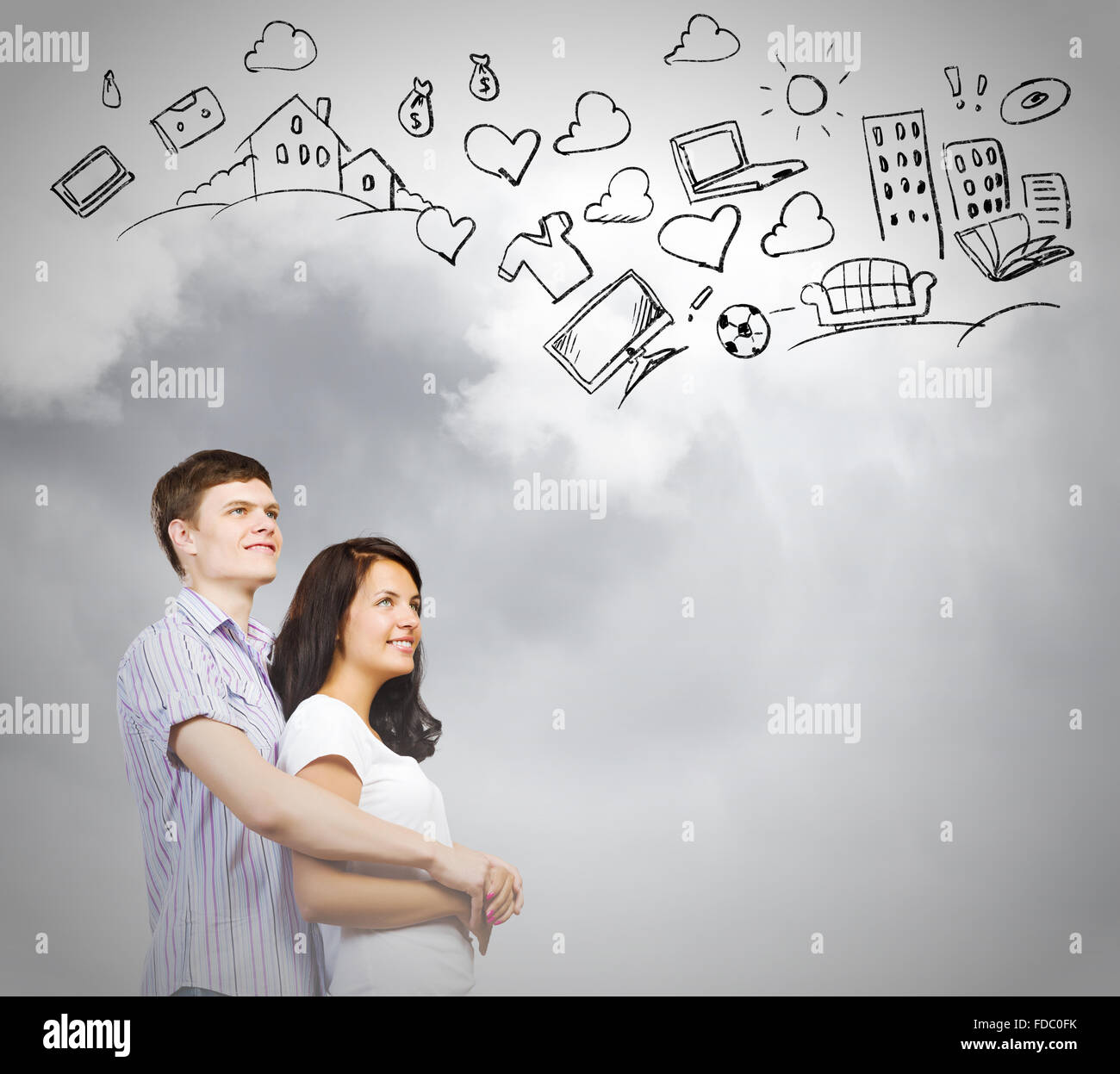 Young couple hugging each other and dreaming about future Stock Photo ...